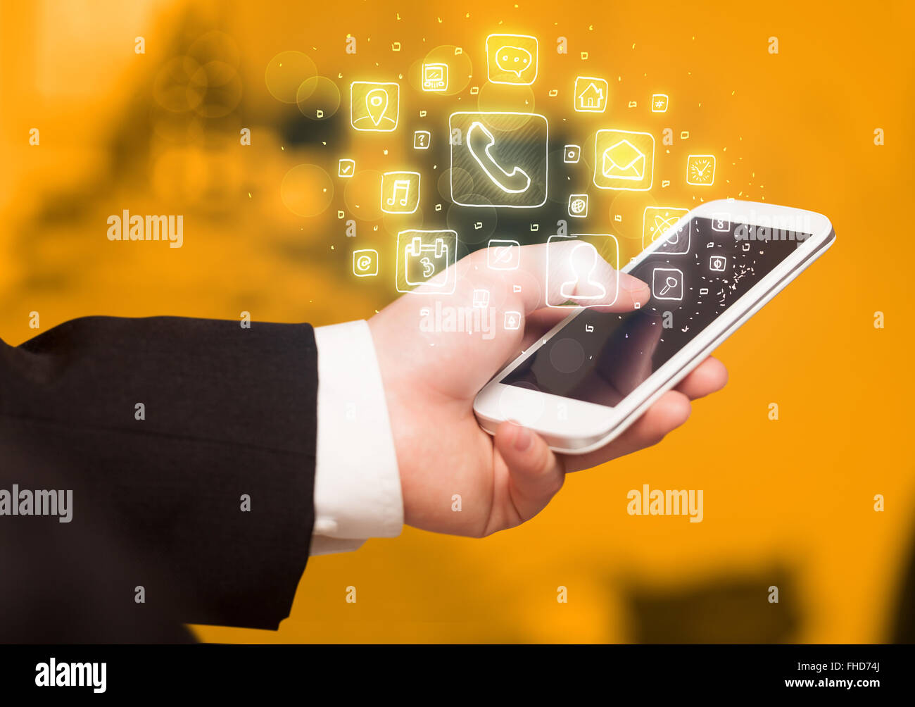 Hand holding smartphone with mobile app icons Stock Photo - Alamy
