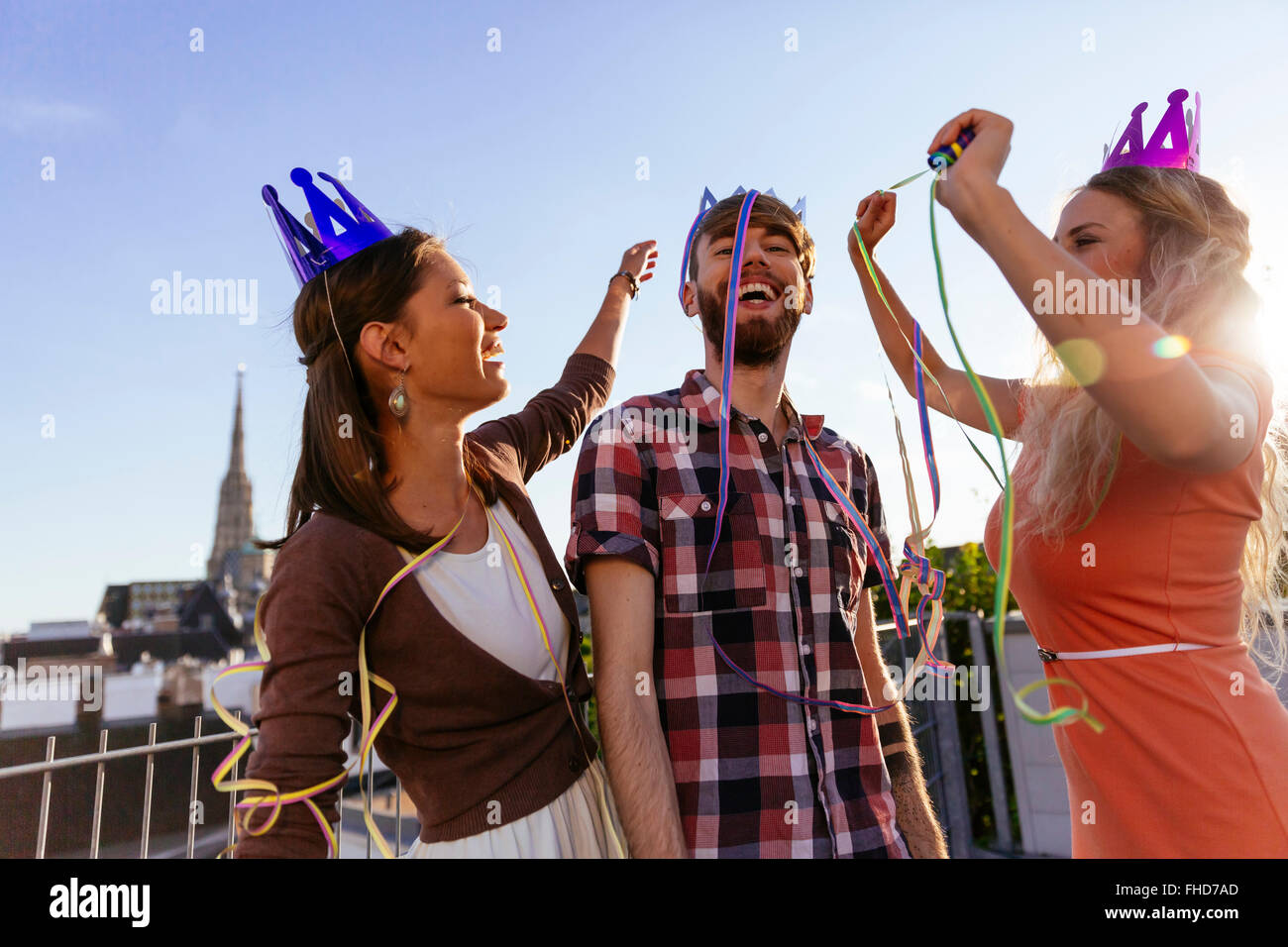 Austria, Vienna, Young people having a party on rooftop terrace Stock ...
