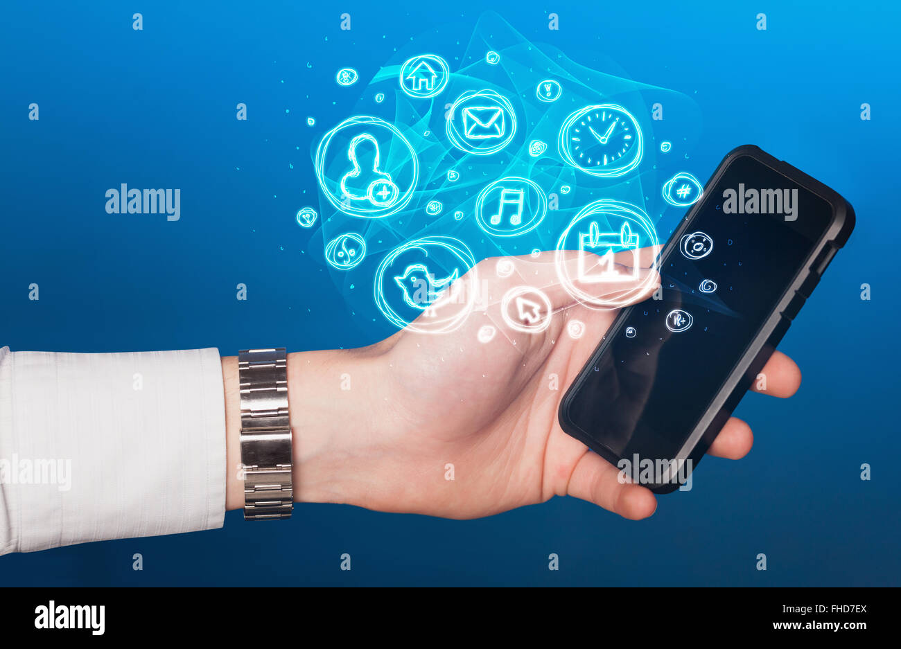 Hand holding smartphone with mobile app choices Stock Photo - Alamy