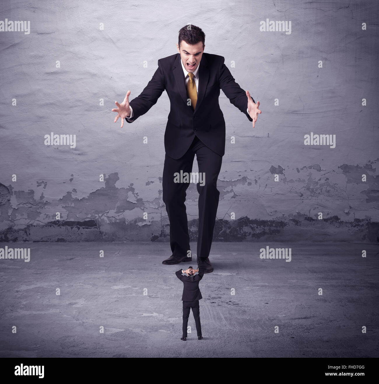 Angry big manager looking at small business man Stock Photo - Alamy