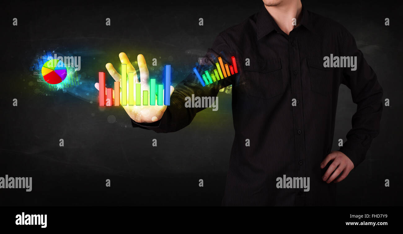 Handsome young business man touching colorful modern graph system ...