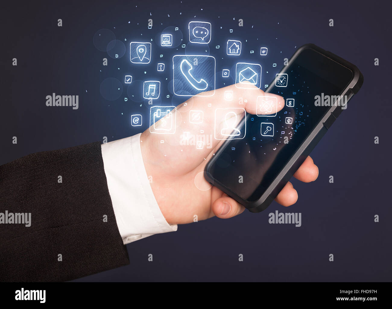 Hand holding smartphone with mobile app icons Stock Photo - Alamy