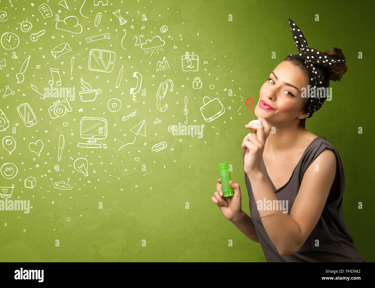 Cute girl blowing hand drawn media icons and symbols Stock Photo - Alamy