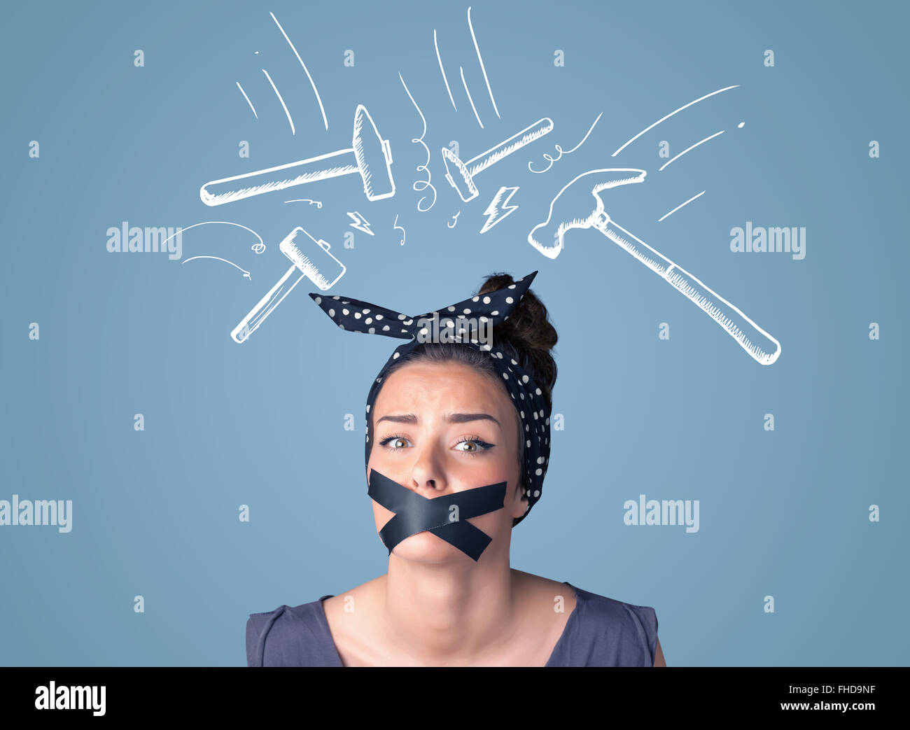 Young woman with glued mouth and hammer marks Stock Photo - Alamy
