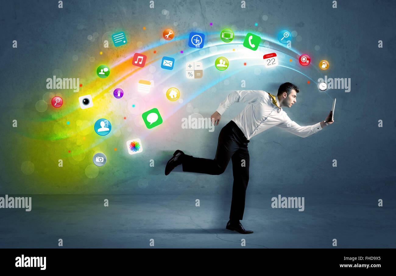 Running businessman with application icons from device Stock Photo - Alamy