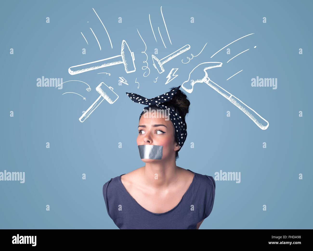 Young woman with glued mouth and hammer marks Stock Photo - Alamy