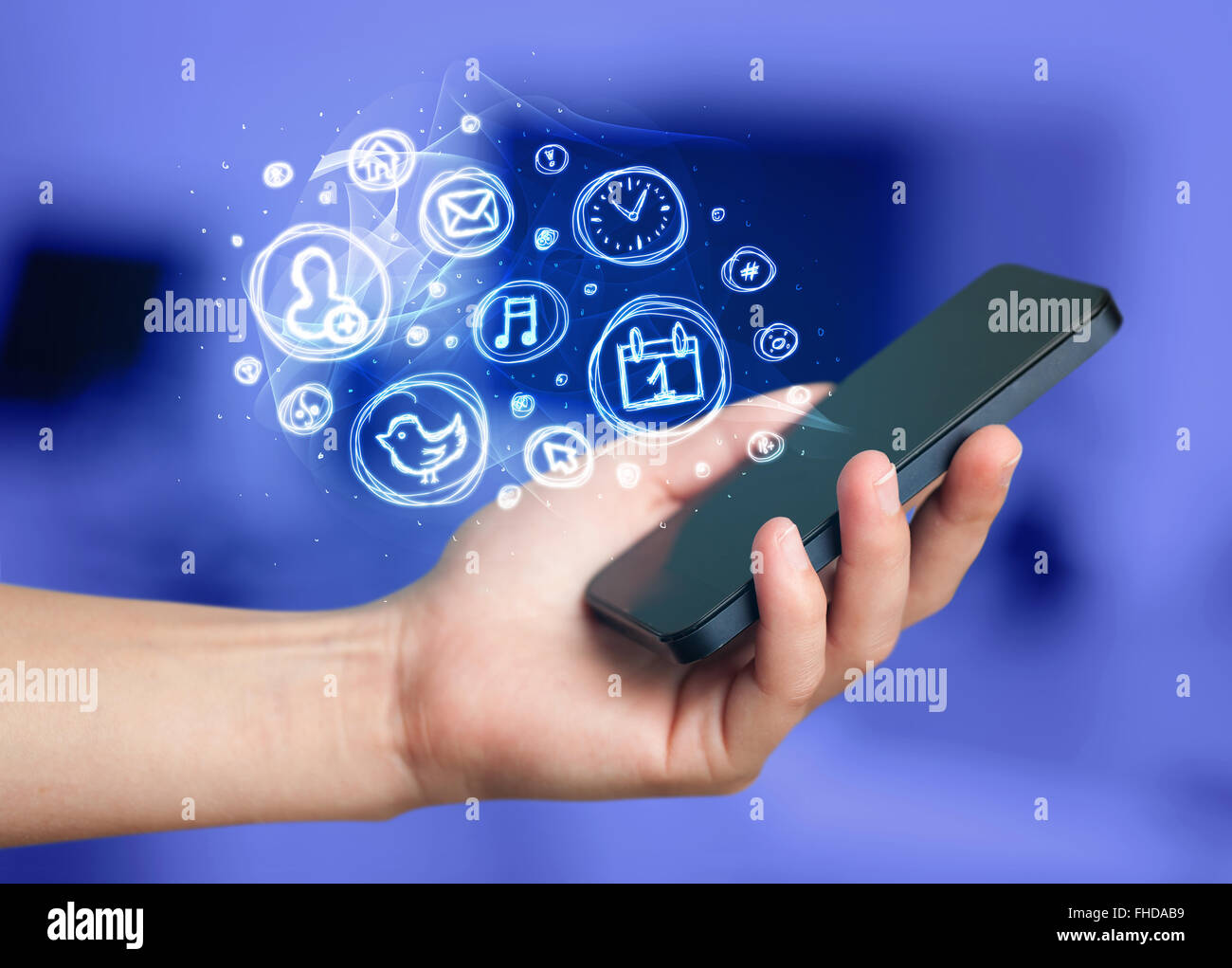 Hand holding smartphone with mobile app choices Stock Photo - Alamy