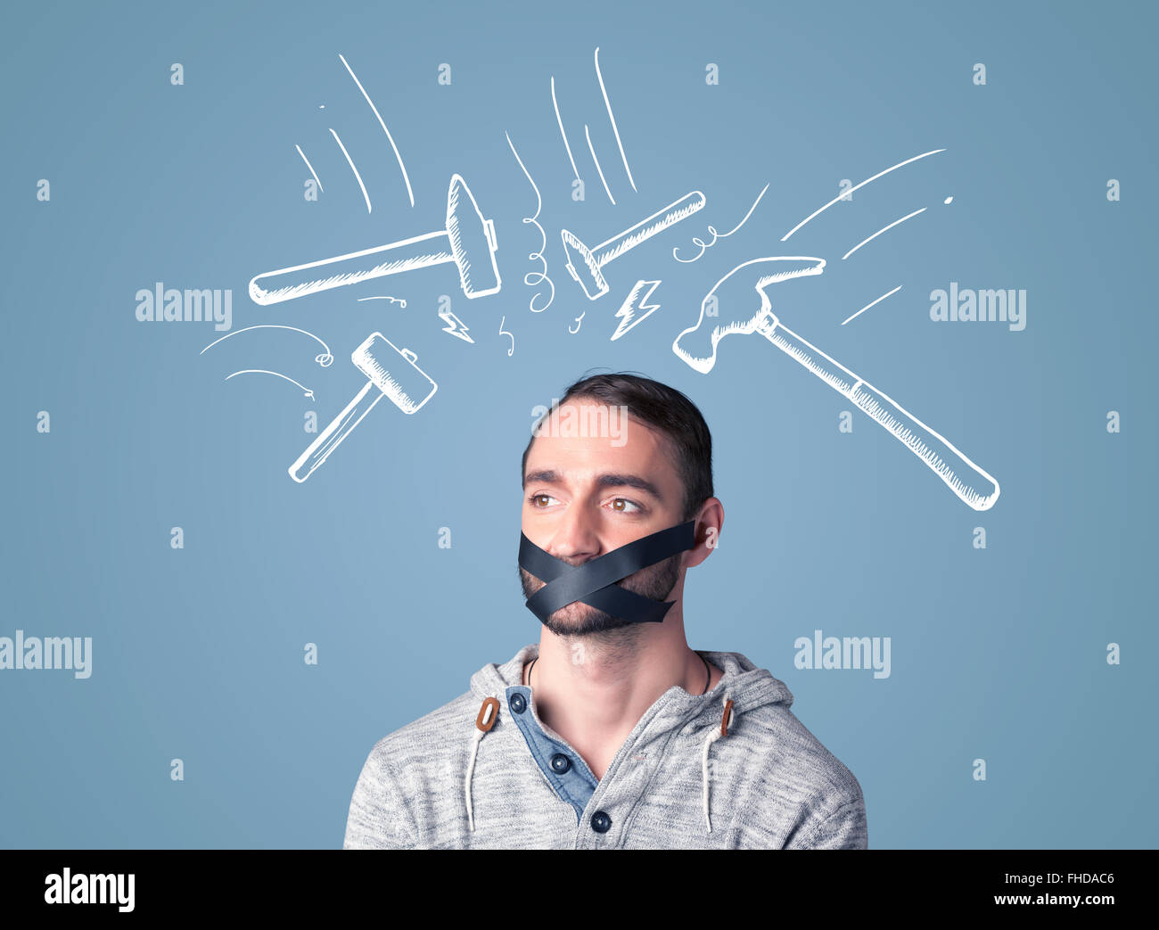 Young man with glued mouth and beating hammer marks Stock Photo - Alamy