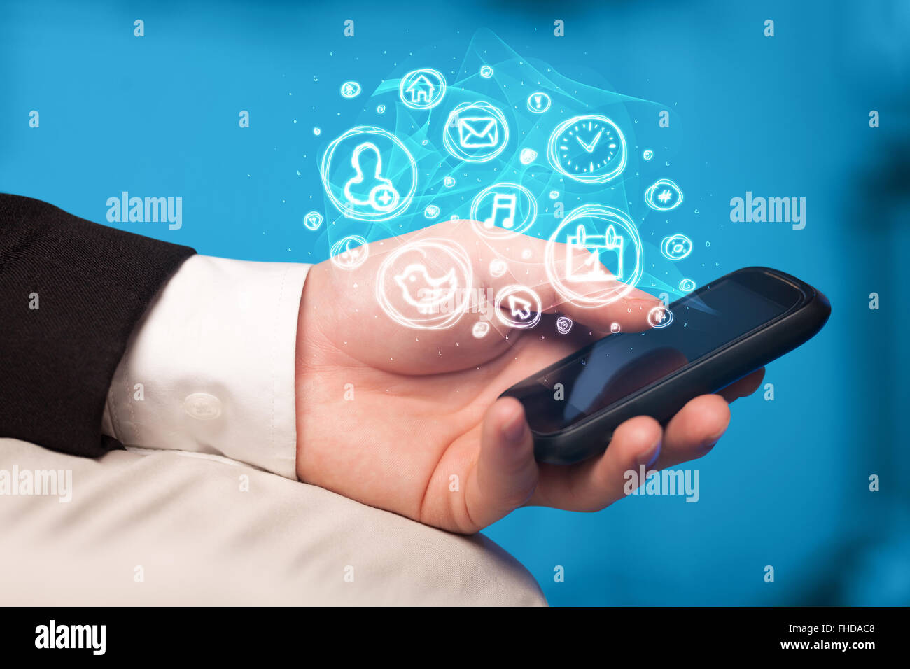 Hand holding smartphone with mobile app choices Stock Photo - Alamy