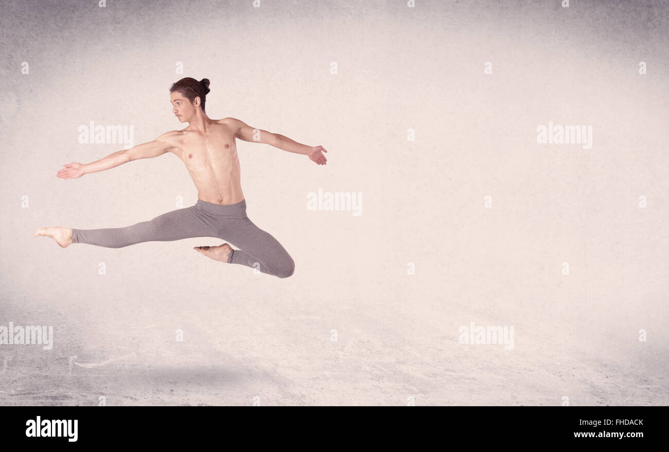 Modern ballet dancer performing art jump with empty background Stock ...