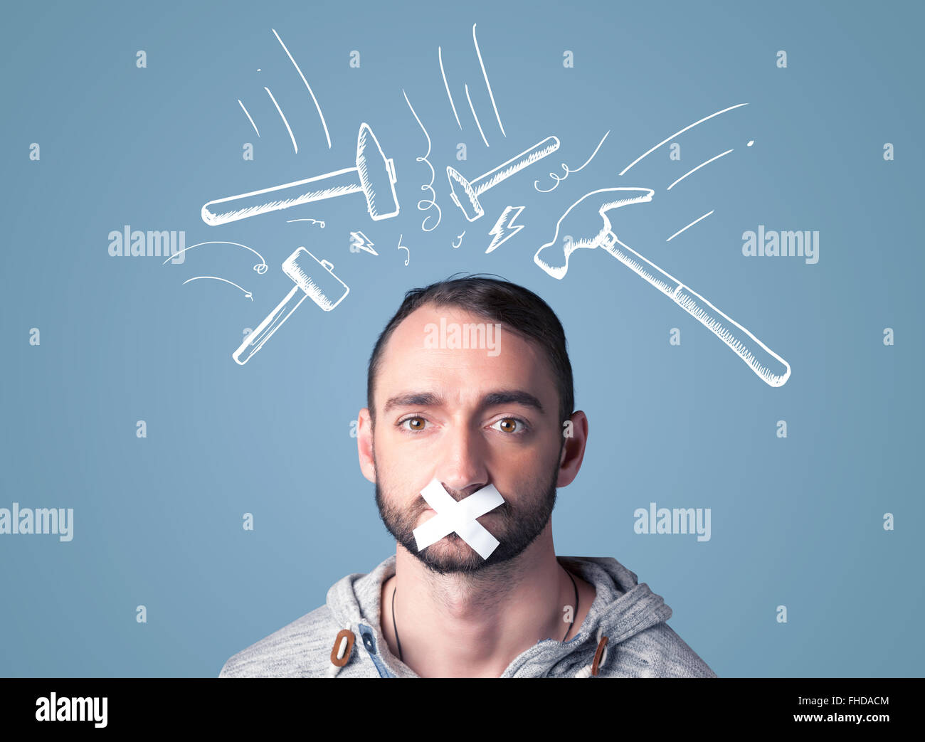 Young man with glued mouth and beating hammer marks Stock Photo - Alamy
