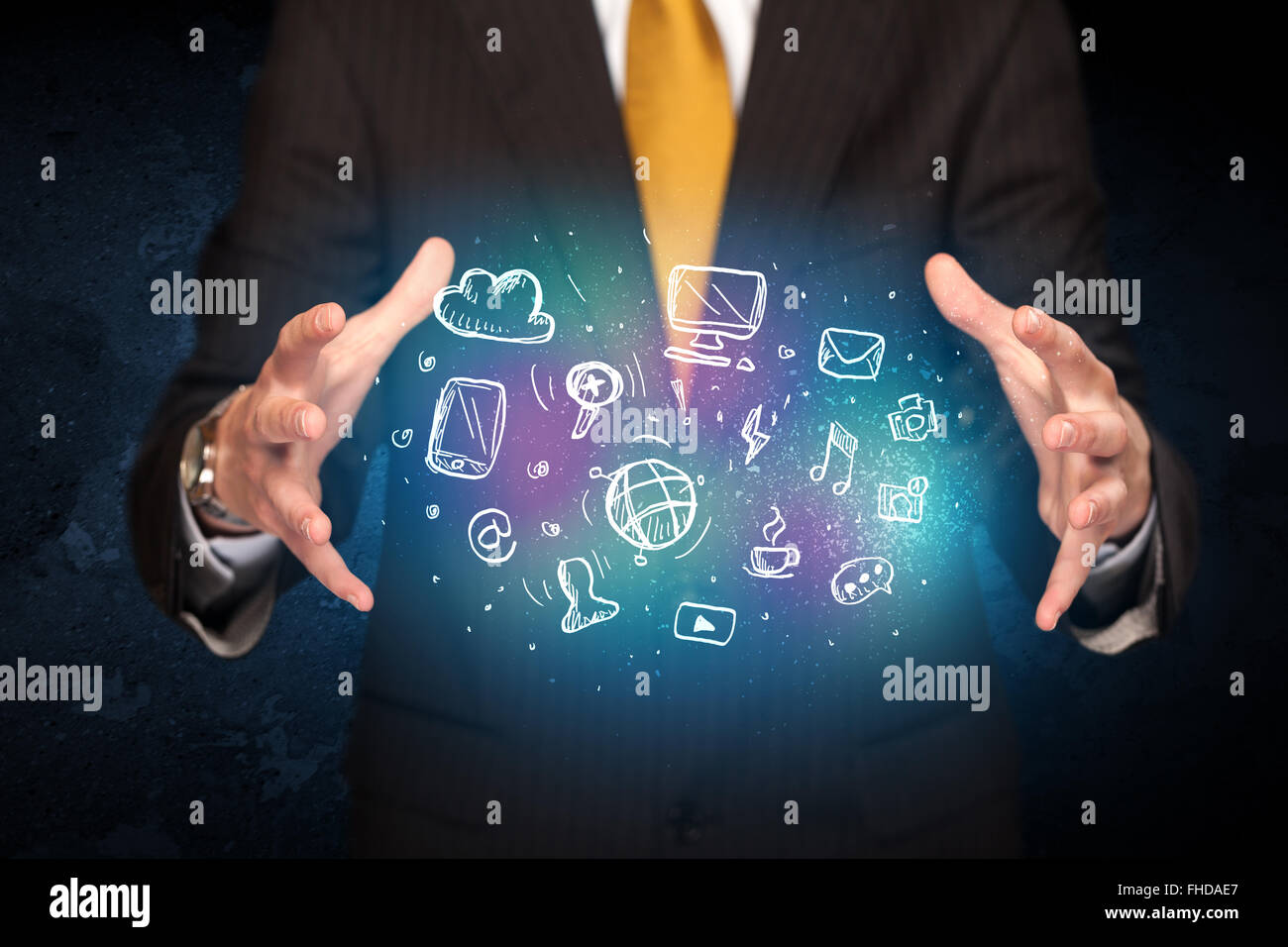 holding hand drawn media icons Stock Photo - Alamy