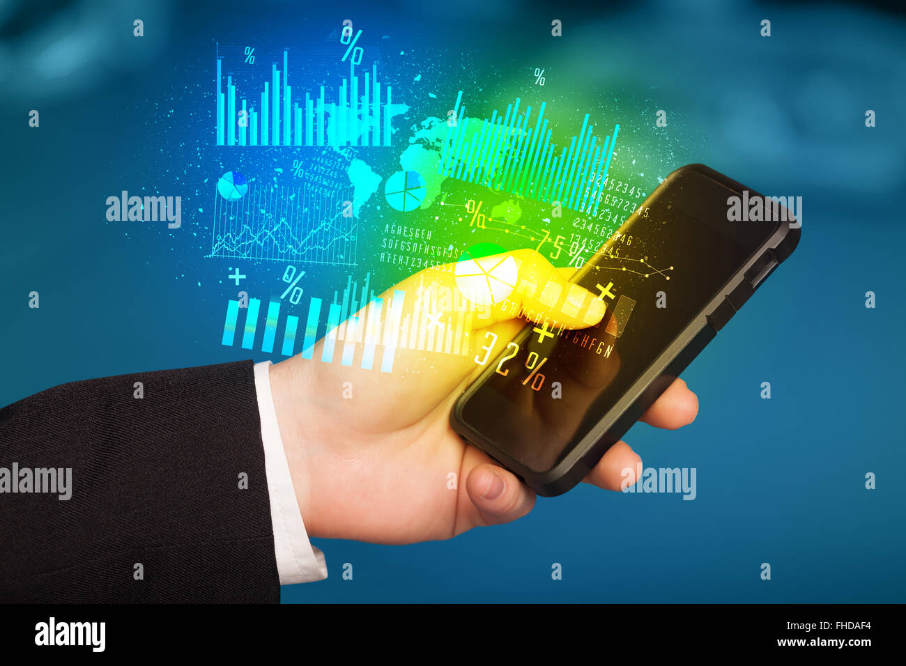 Hand holding smartphone with business diagrams Stock Photo - Alamy