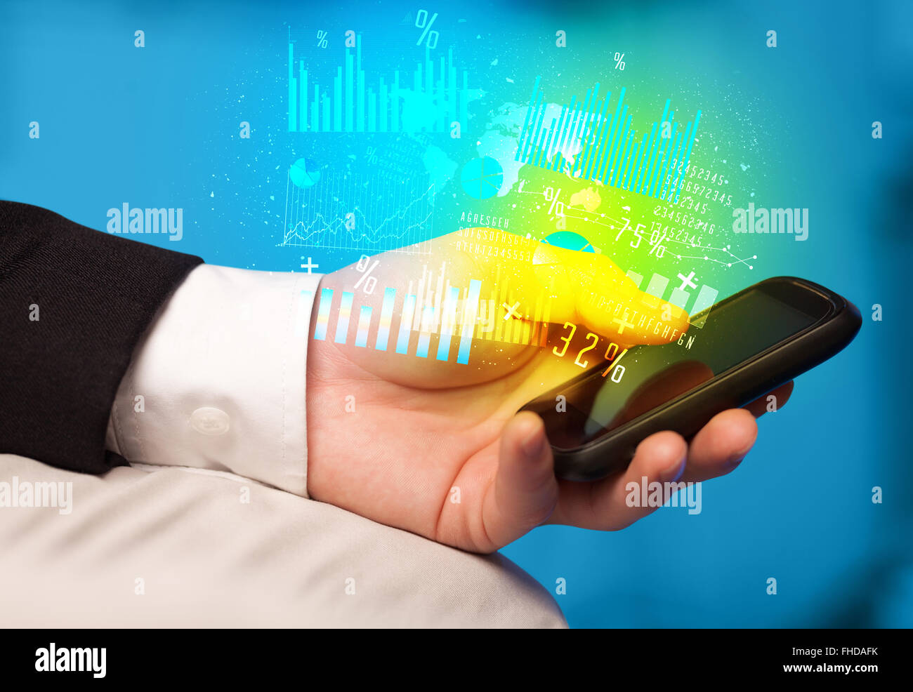 Hand holding smartphone with business diagrams Stock Photo - Alamy