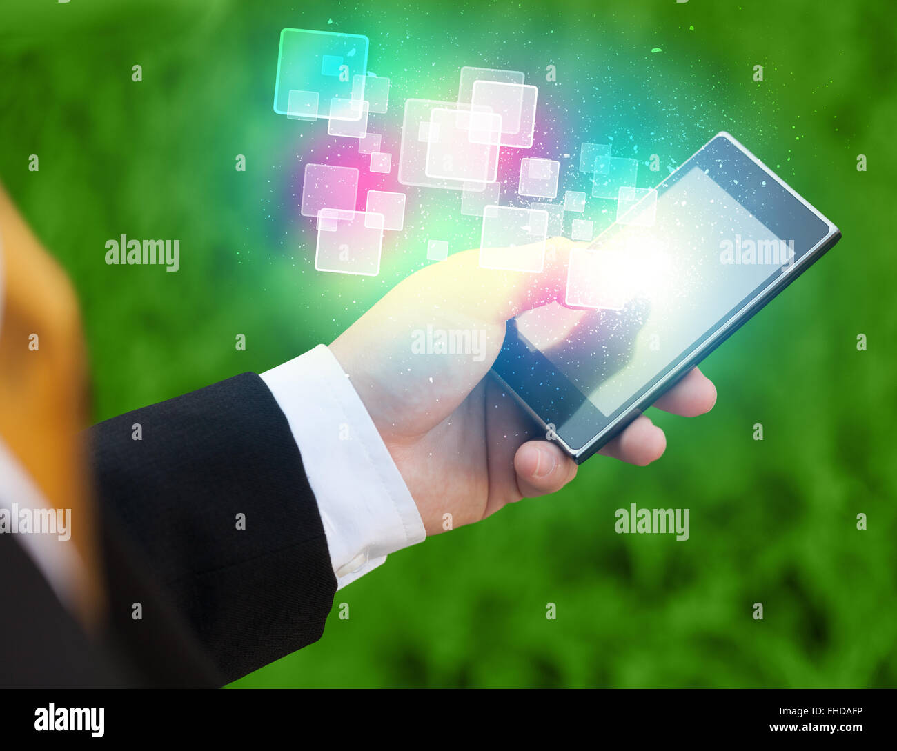 Hand holding smart phone with abstract glowing squares Stock Photo - Alamy