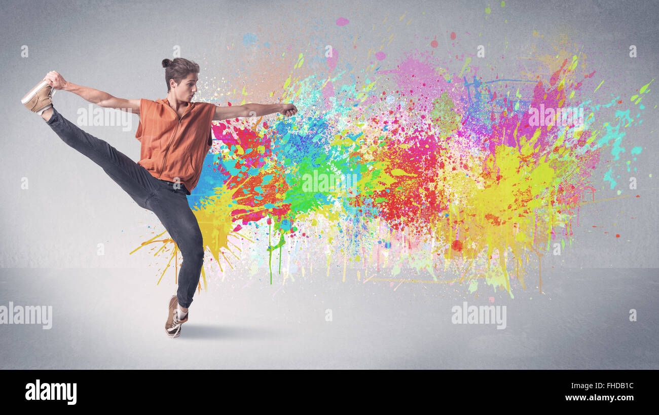 Young colorful street dancer with paint splash Stock Photo - Alamy