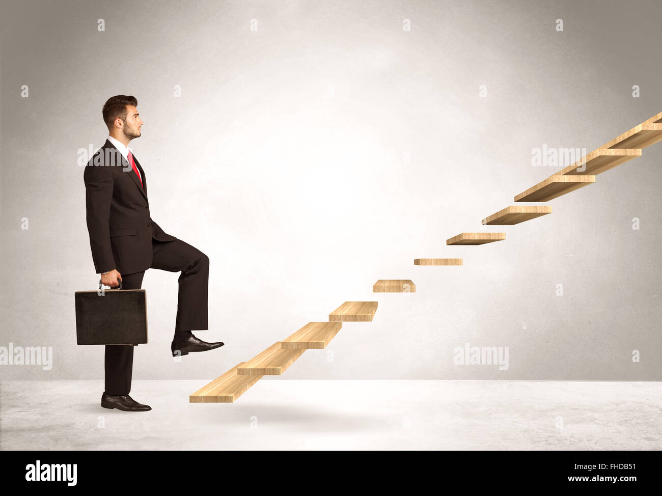Stepping up a staircase Stock Photo - Alamy