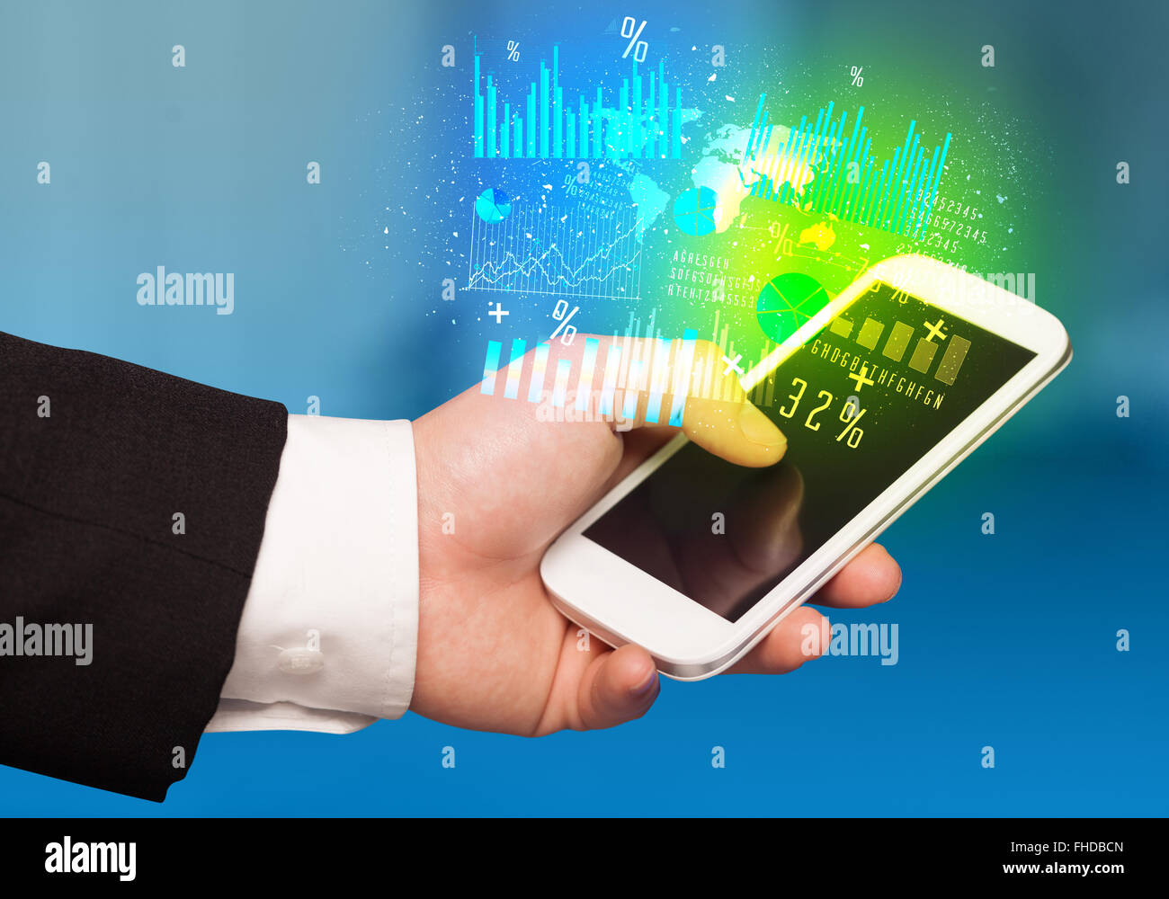 Hand holding smartphone with business diagrams Stock Photo - Alamy