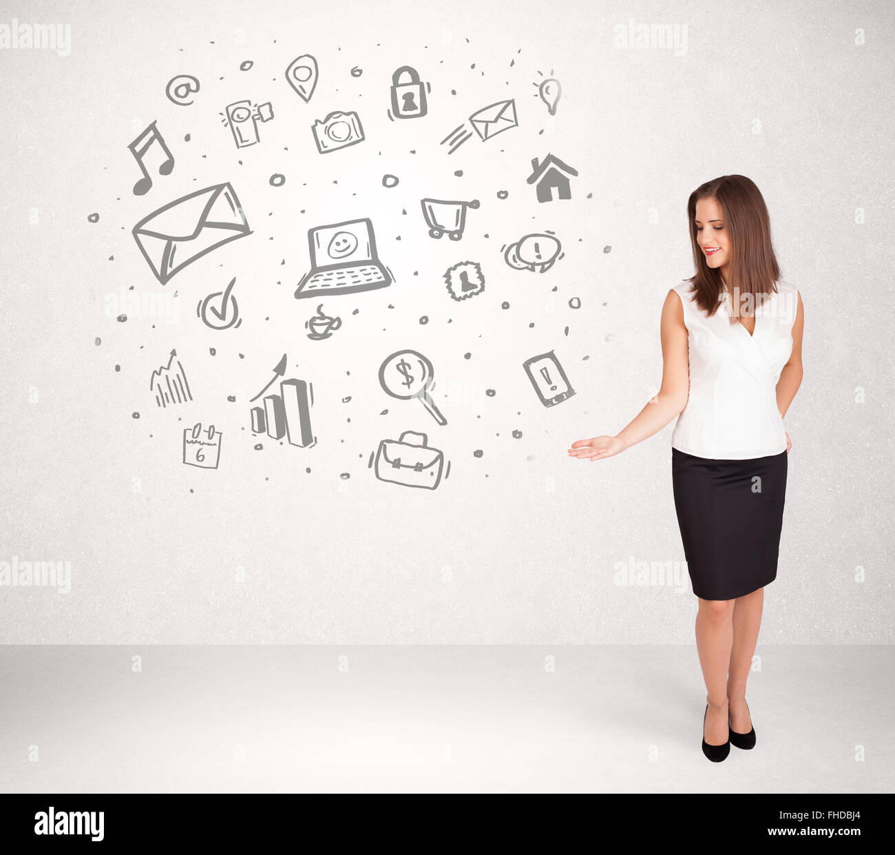 Young business woman presenting hand drawn media icons Stock Photo - Alamy