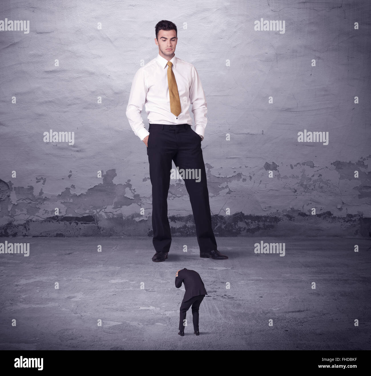 Angry big manager looking at small business man Stock Photo - Alamy