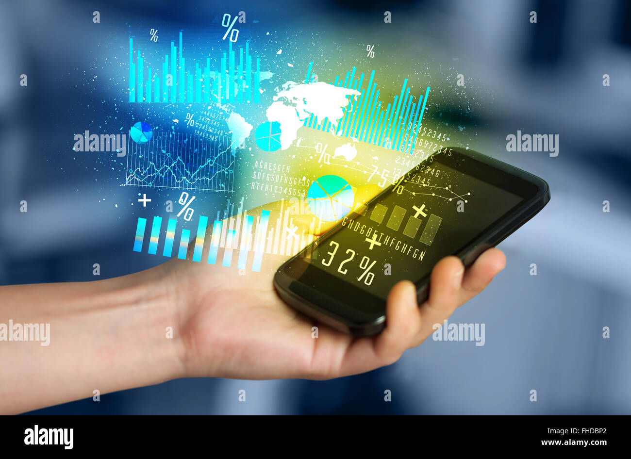 Hand holding smartphone with business diagrams Stock Photo - Alamy