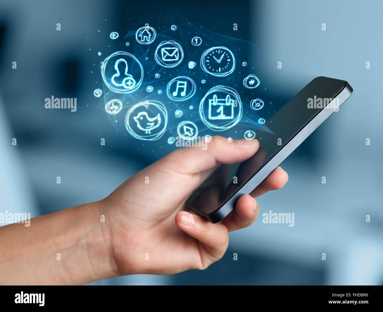 Hand holding smartphone with mobile app choices Stock Photo - Alamy