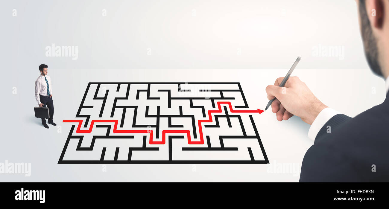 Business man looking at hand drawing solution Stock Photo - Alamy