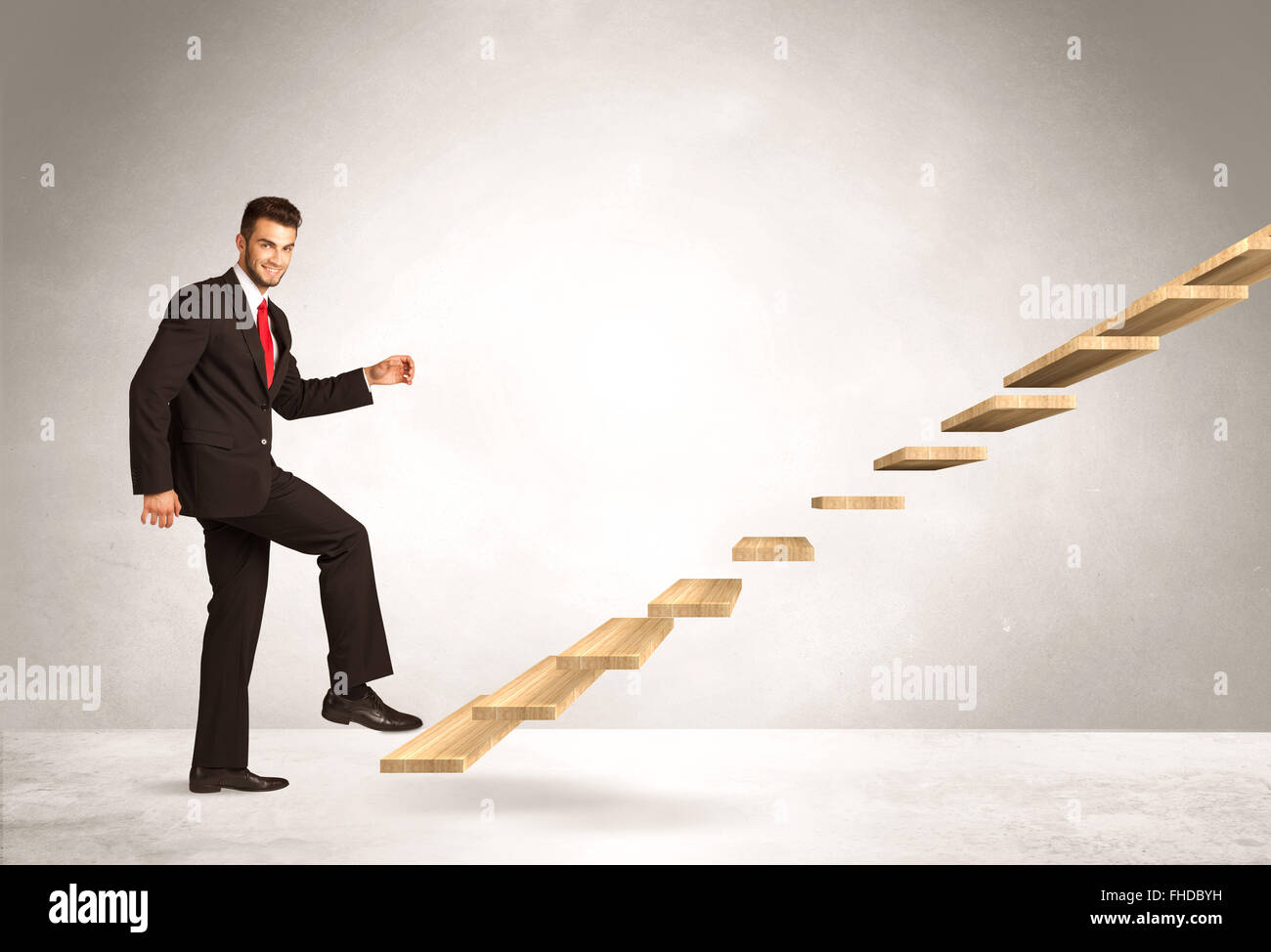 Stepping up a staircase Stock Photo - Alamy