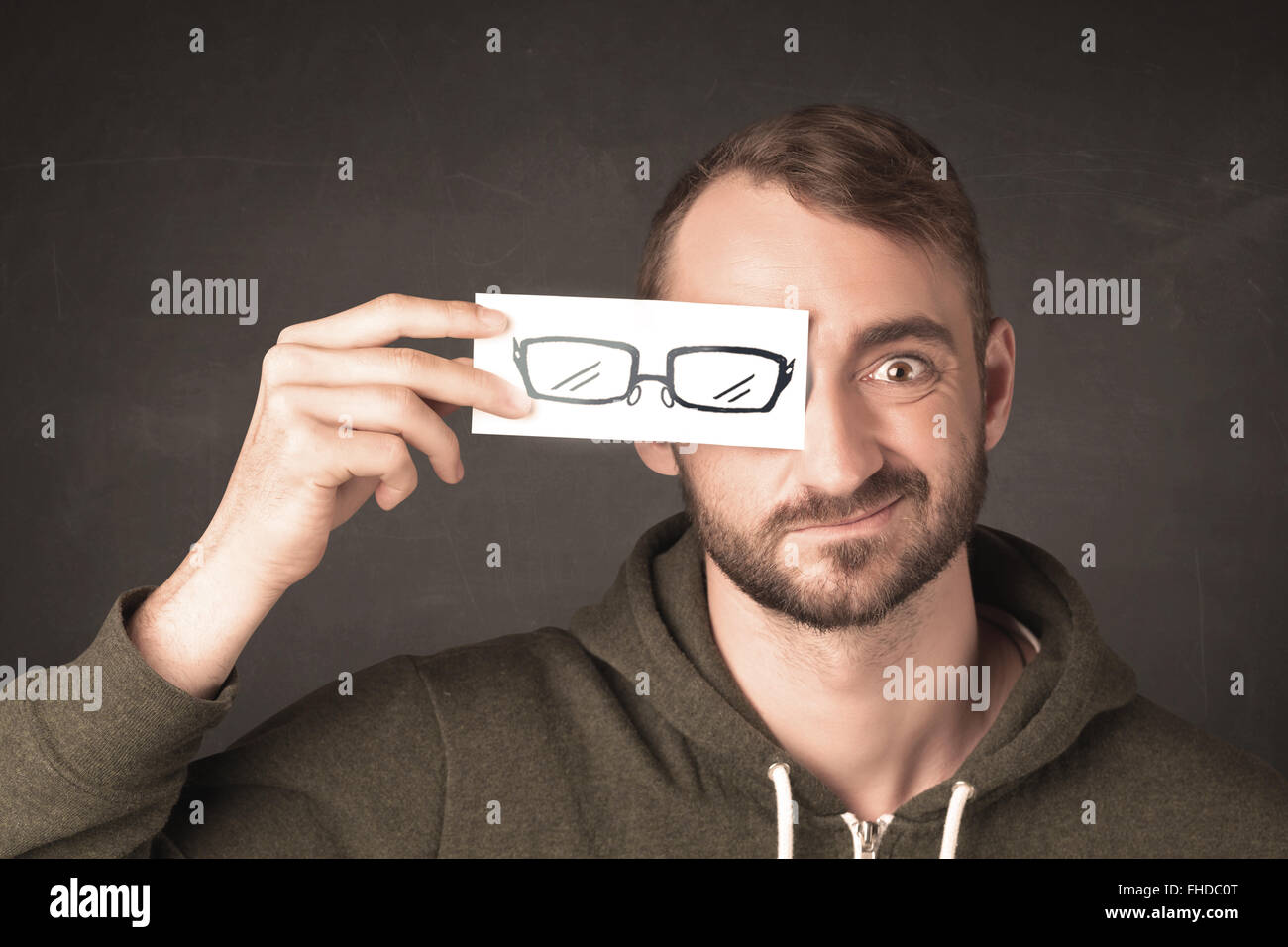 Happy guy looking with paper hand drawn eye glasses Stock Photo - Alamy