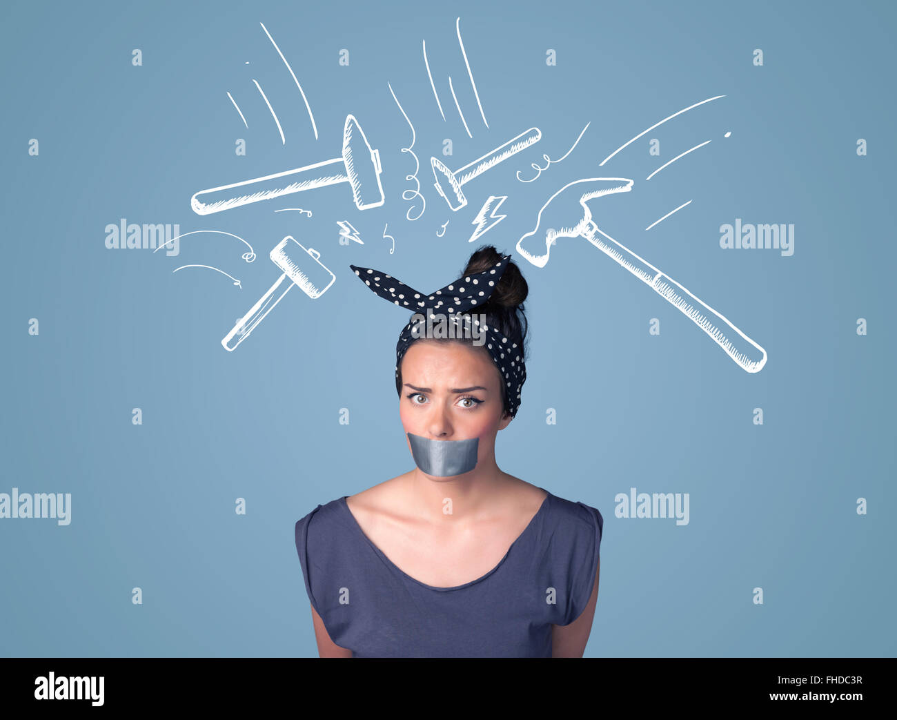 Young woman with glued mouth and hammer marks Stock Photo - Alamy