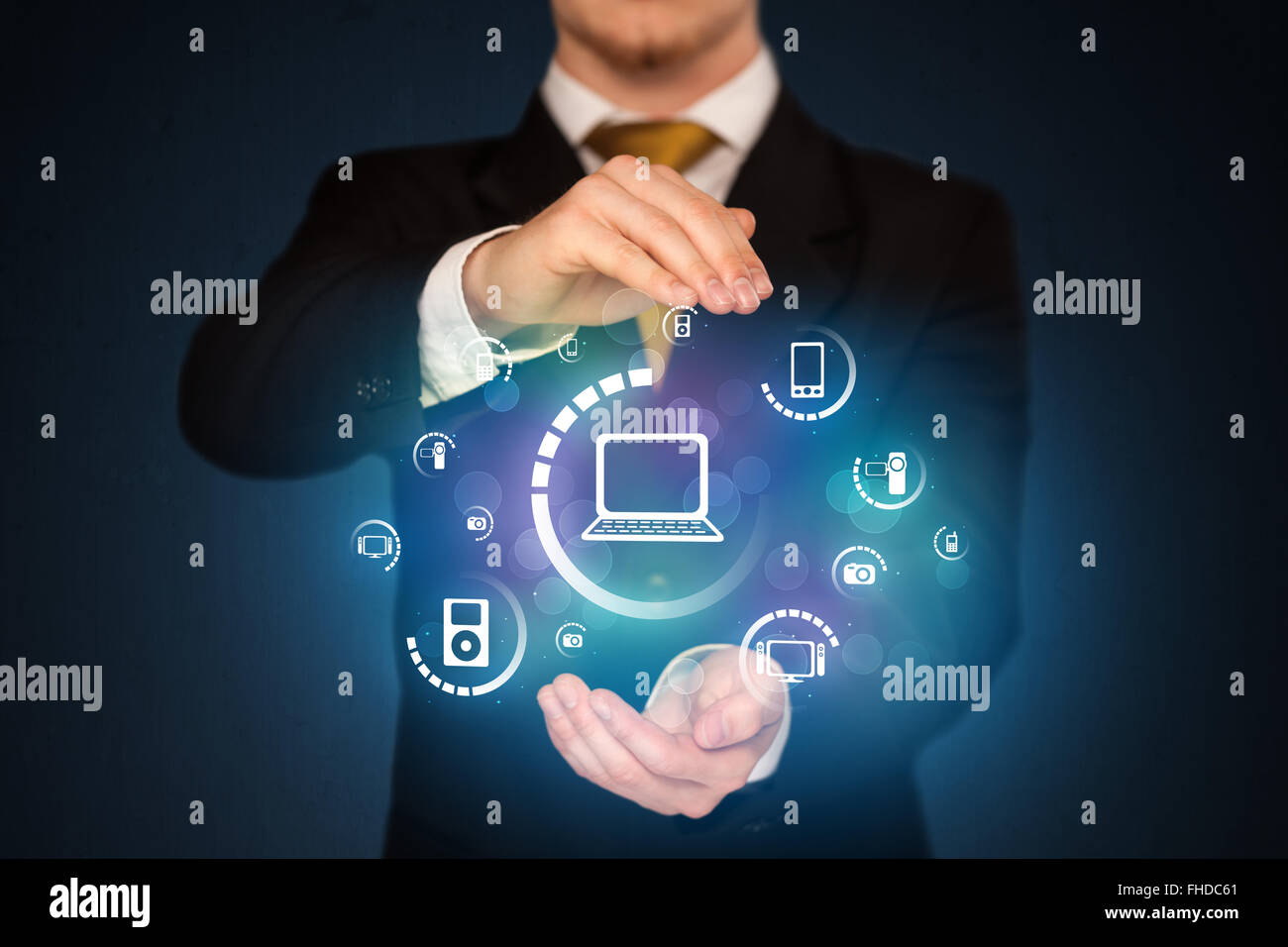 holding digital media icons Stock Photo - Alamy