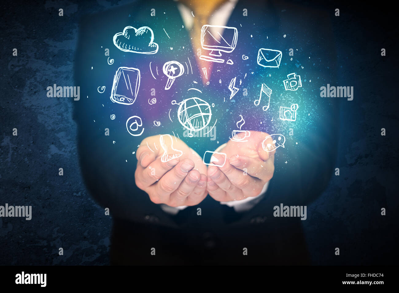 holding hand drawn media icons Stock Photo - Alamy