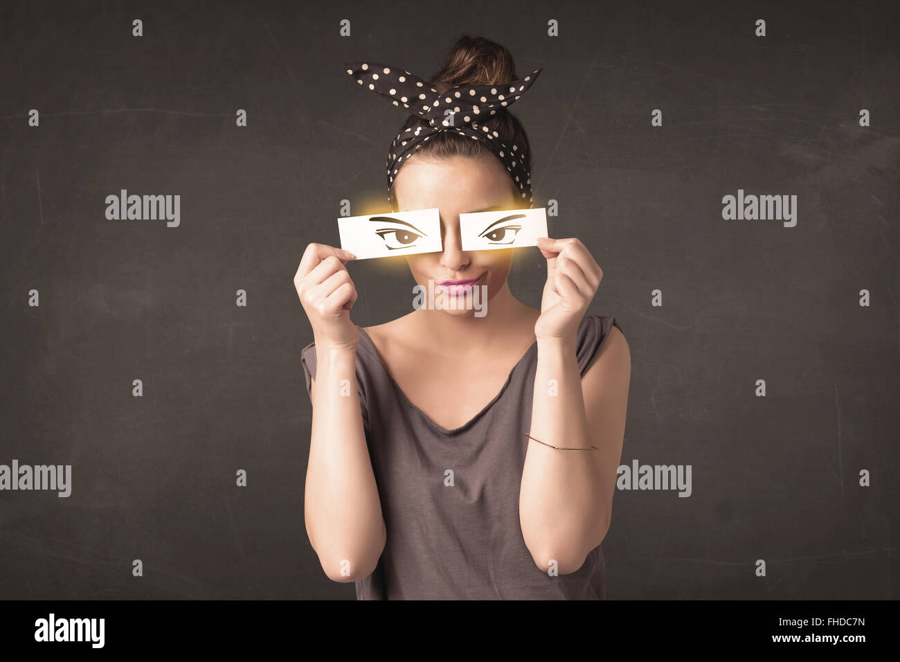 Cool youngster looking with a paper hand drawn eyes Stock Photo - Alamy