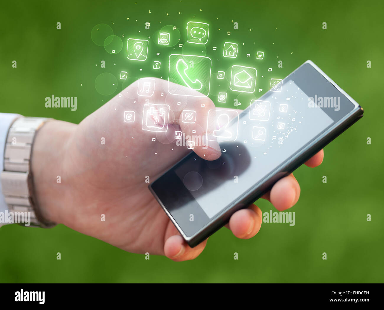 Hand holding smartphone with mobile app icons Stock Photo - Alamy