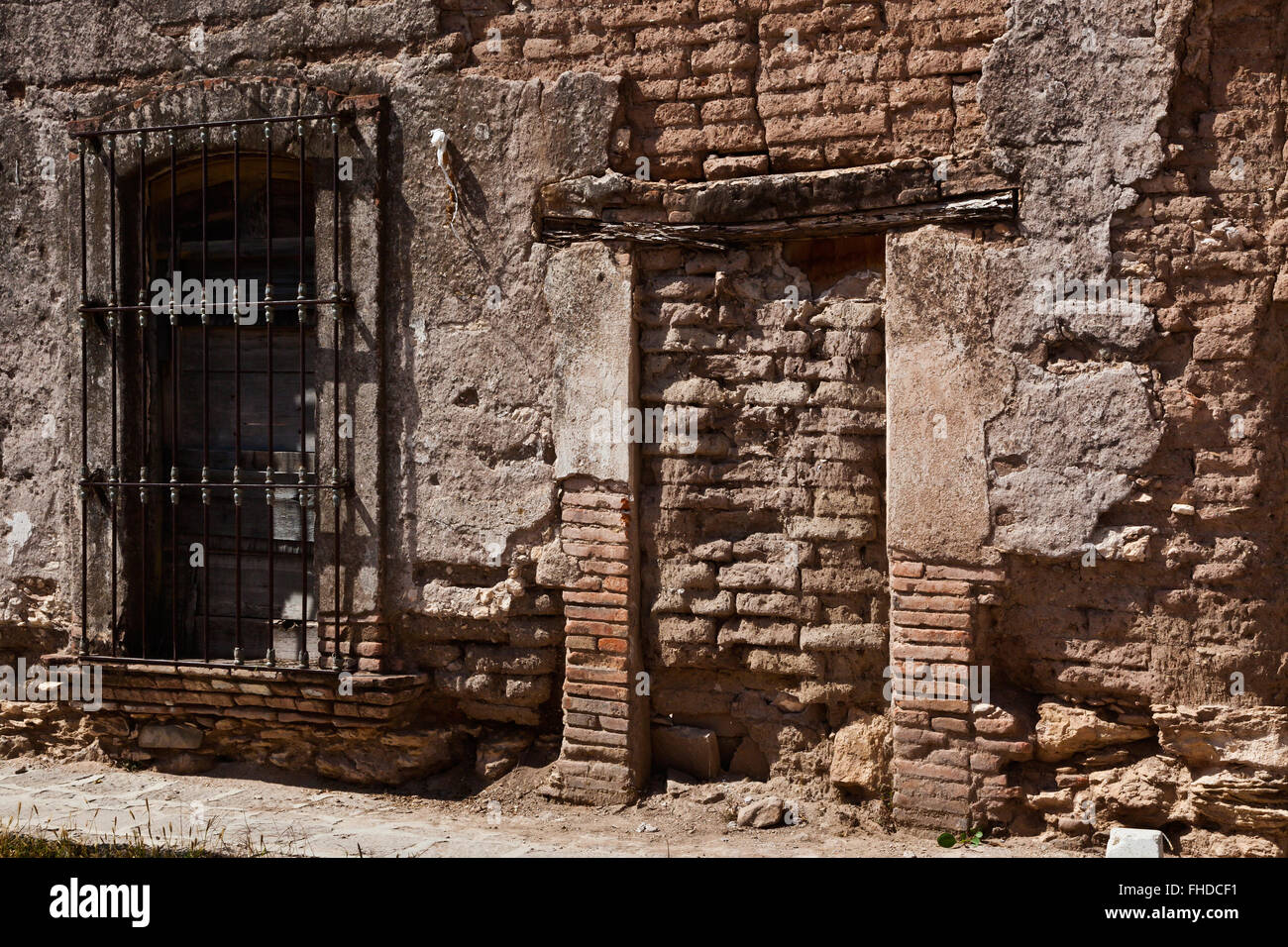 An old adobe wall and window in historic MINERAL DE POZOS which was ...