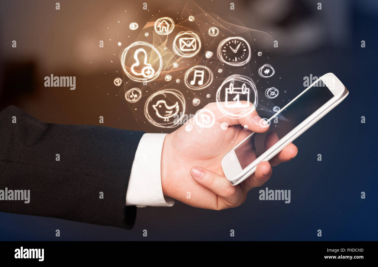 Hand holding smartphone with mobile app choices Stock Photo - Alamy
