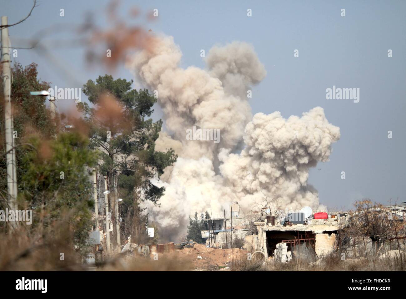 Daraya, Damascus. 24th February, 2016. Somkes rise following airstrike ...