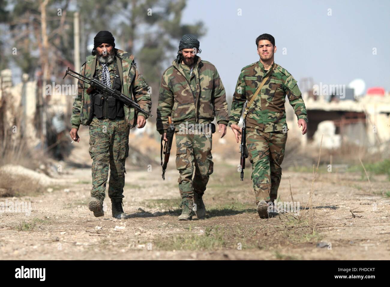 Daraya, Damascus. 24th February, 2016. Syrian soldiers walk past ...