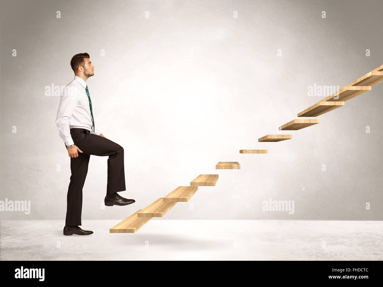 Stepping up a staircase Stock Photo - Alamy