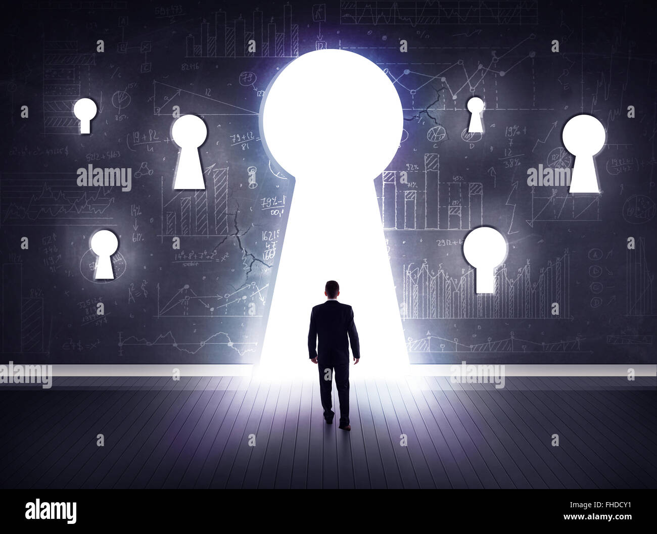businessman looking through keyhole Stock Photo - Alamy