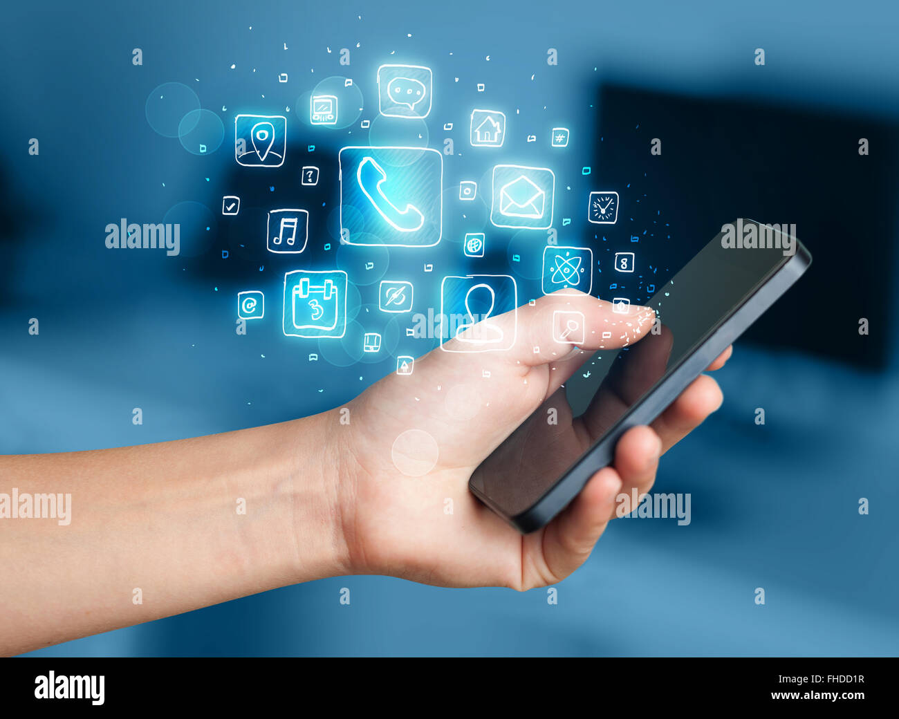 Hand holding smartphone with mobile app icons Stock Photo - Alamy