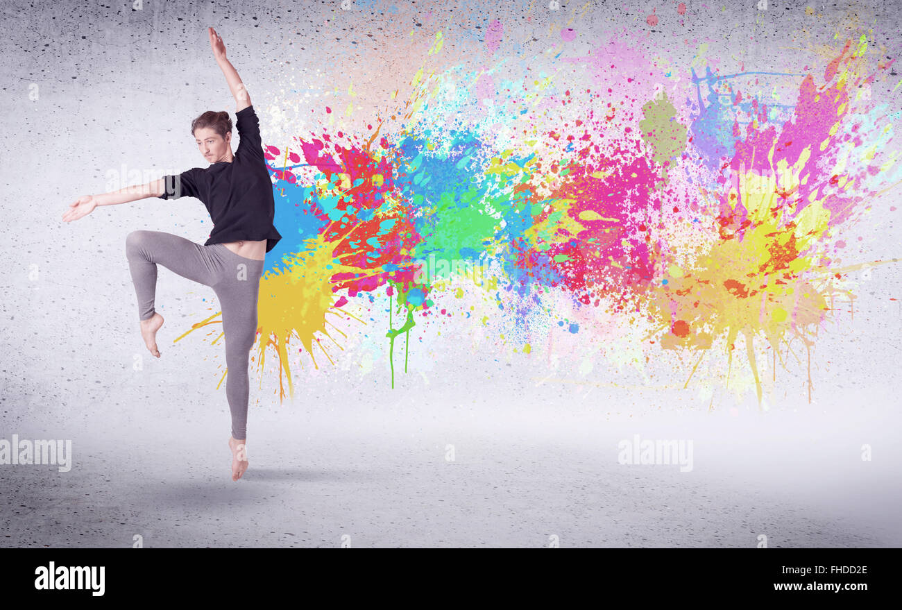 Modern street dancer jumping with colorful paint splashes Stock Photo ...