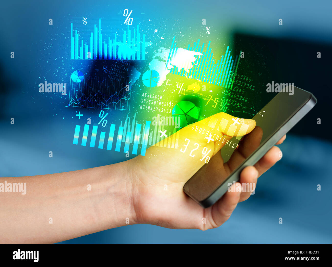 Hand holding smartphone with business diagrams Stock Photo - Alamy