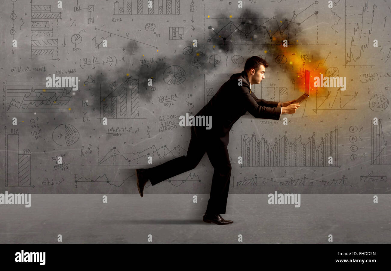 Running business man with fire laptop Stock Photo - Alamy