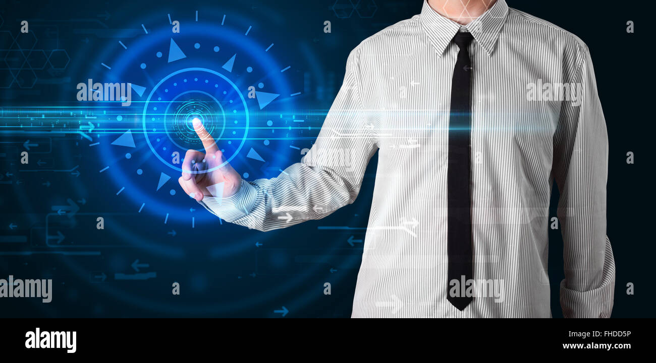 Handsome tech guy pressing high technology control panel screen concept ...