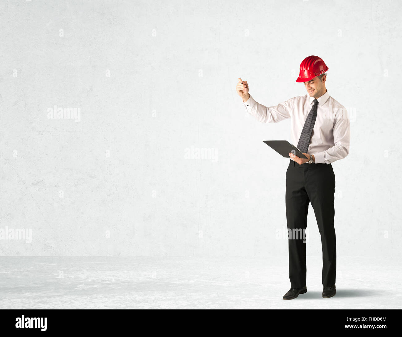 Young architect drawing in empty space Stock Photo - Alamy