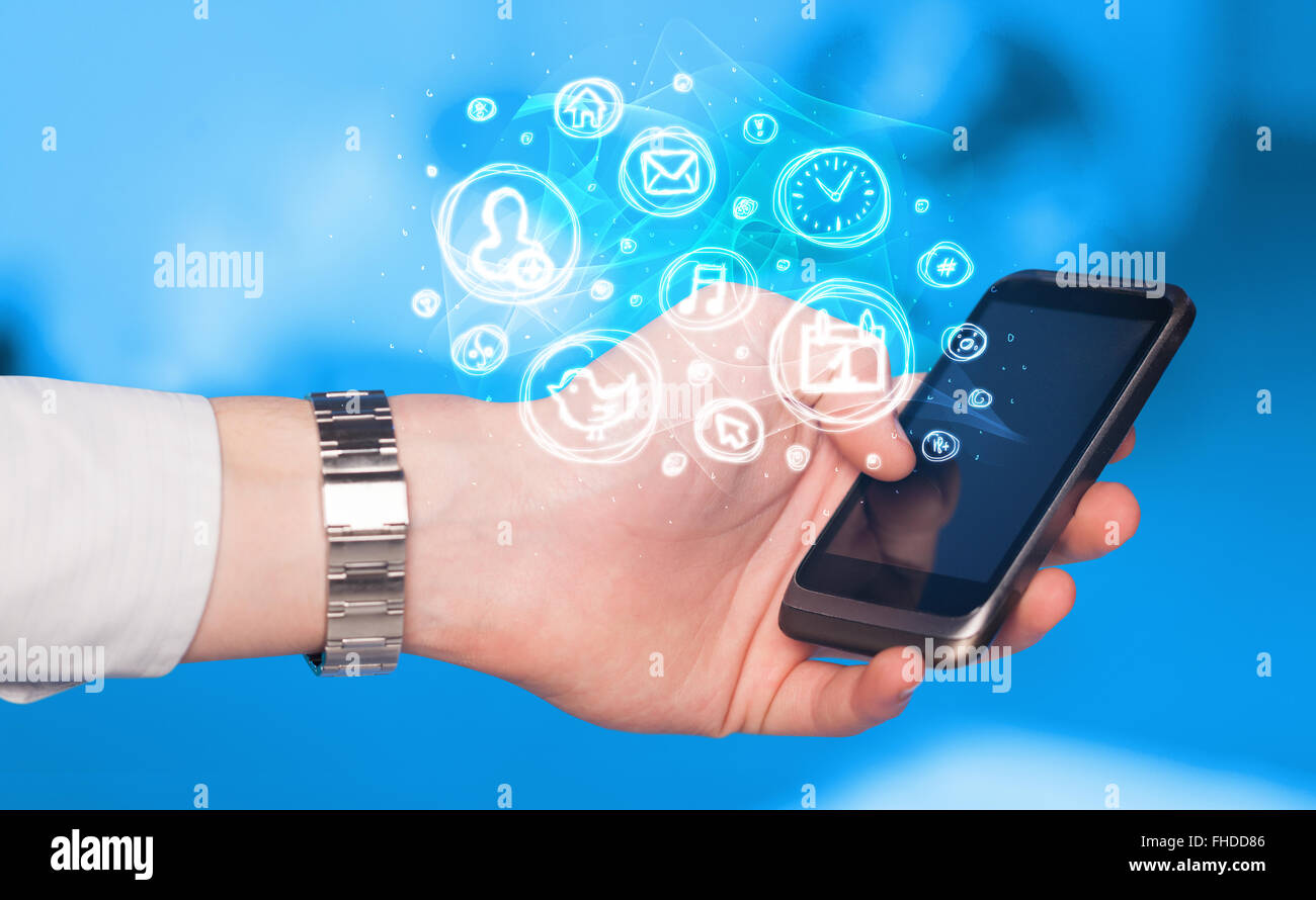 Hand holding smartphone with mobile app choices Stock Photo - Alamy