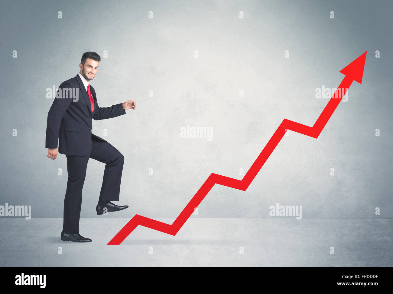 Climbing on red graph arrow Stock Photo - Alamy
