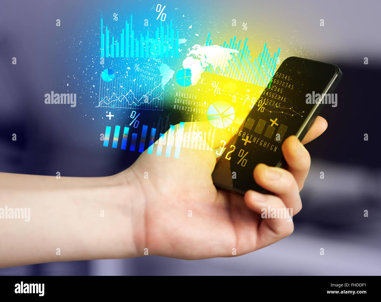 Hand holding smartphone with business diagrams Stock Photo - Alamy