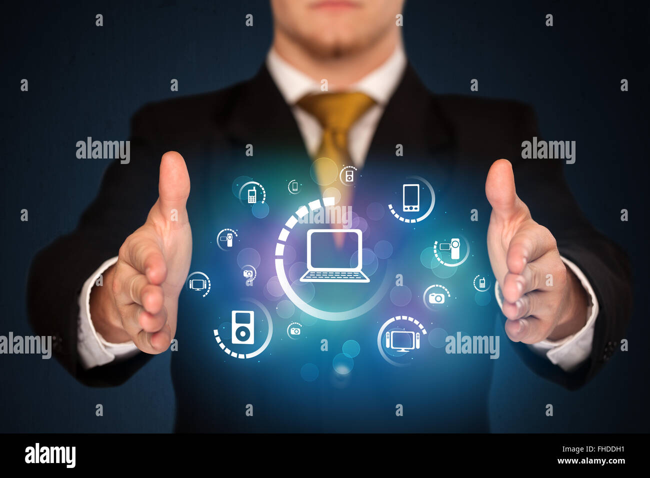 holding digital media icons Stock Photo - Alamy